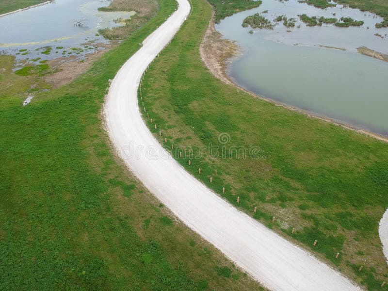 Aerial View of Dirt Road between Two Lakes Stock Photo - Image of view ...