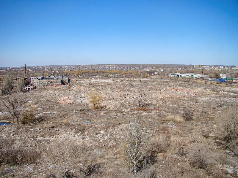 Aerial View of Disaster-struck Landscape with Ash, Debris, and Sparse ...