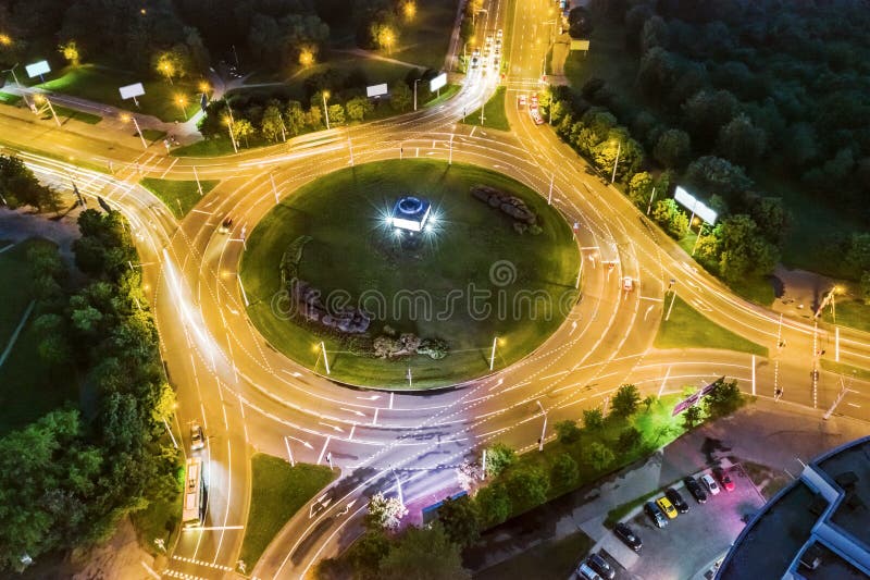 Aerial View Circle Road Intersection and Car Traffic in Twilight Time ... Aerial View Circle Road Intersection and Car Traffic in Twilight Time ...