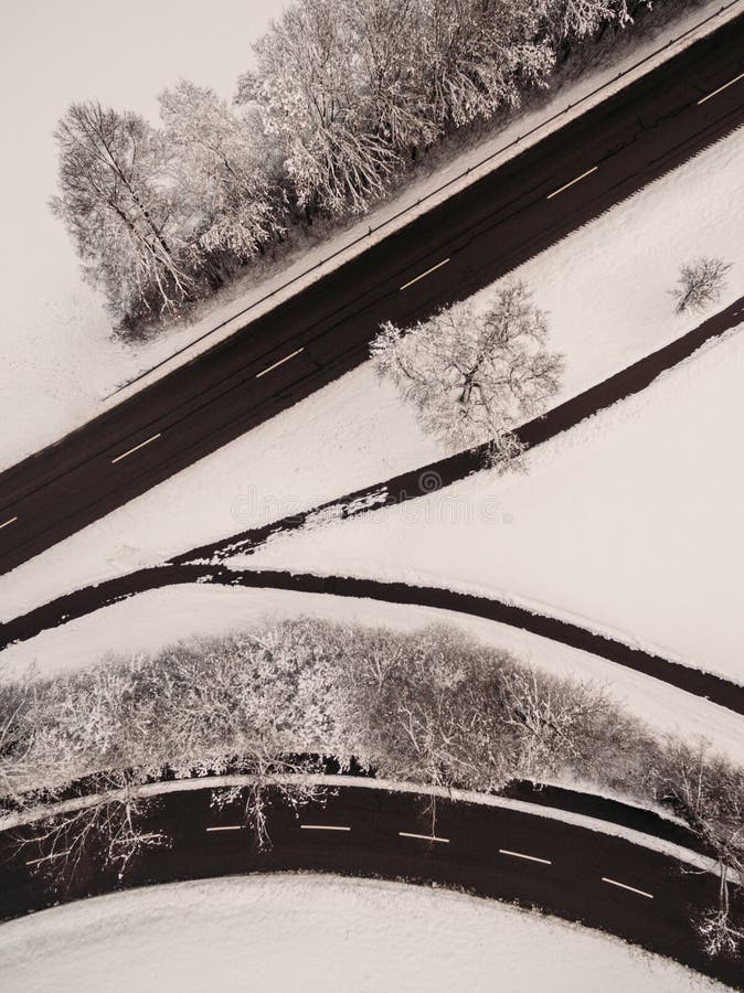 Aerial View of Empty Asphalt Road and Snow-covered Trees Stock Photo ...