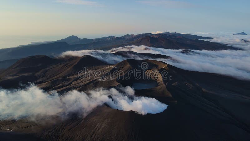 Aerial View of the Eruption of Ash Clouds by Ebeko Volcano. Northern ...