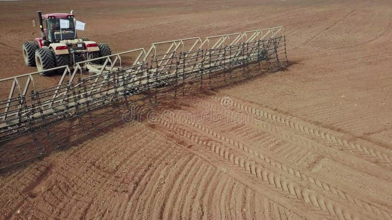 Aerial View of Farming Tractor Plowing and Spraying on Field Stock ...