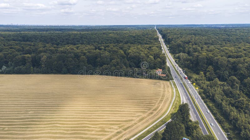 Aerial View of a Forest, Bordered by Fields and Crossed by a Highway ...