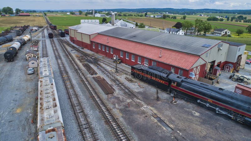 Aerial View of a Freight Yard with an Antique Steam Engine and Freight ...