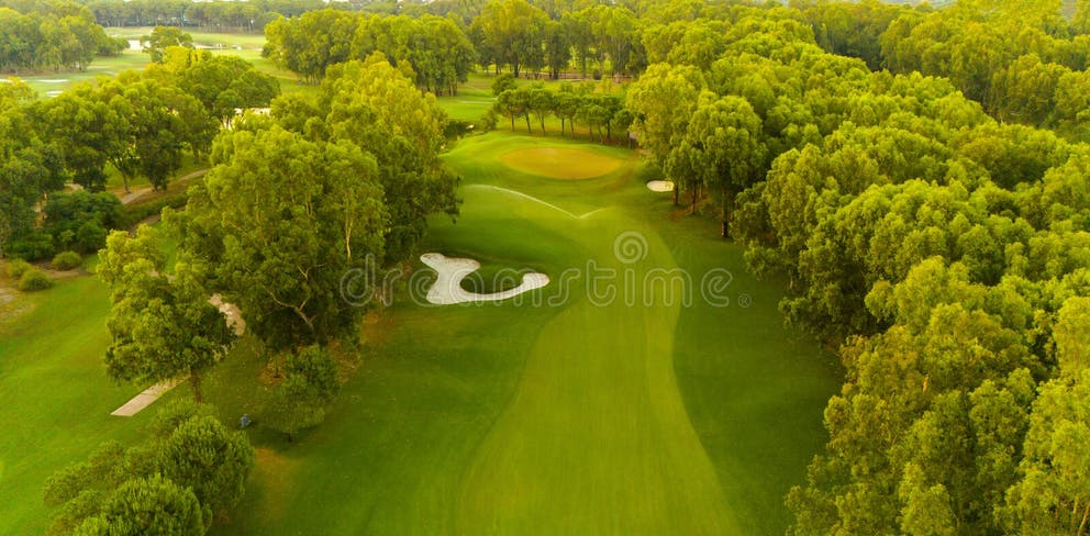An Aerial View of a Golf Course with a Sand Trap and Lush Greenery ...
