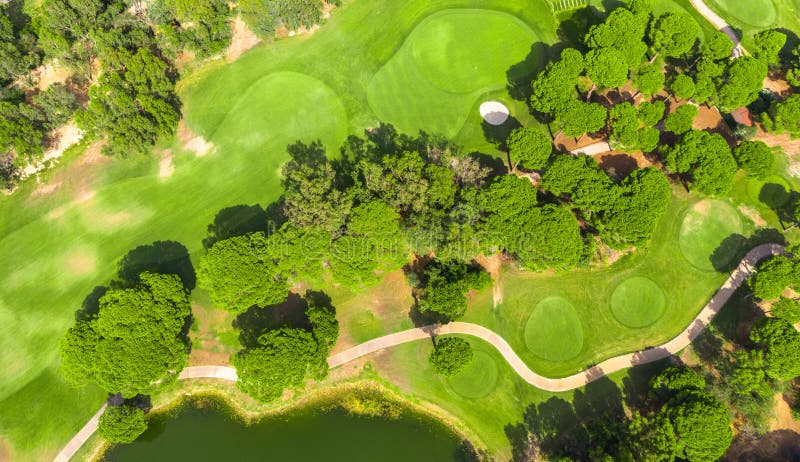Aerial View of a Golf Course with Trees, Sand Bunkers, and a Small Pond ...