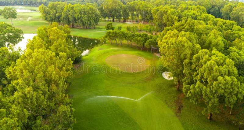 An Aerial View of a Golf Course with Vibrant Greenery and a Tranquil ...
