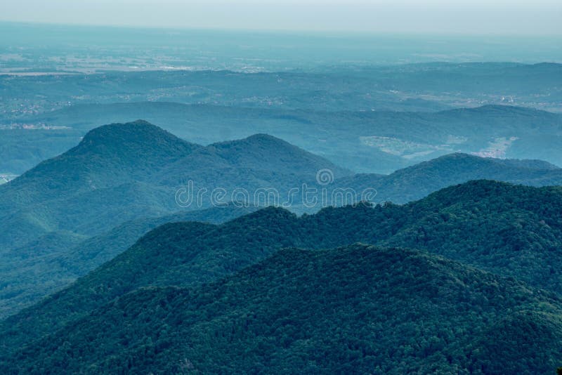 Aerial View of Green Forested Mountains in a Mist Stock Image - Image ...