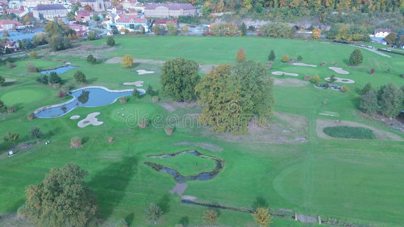 Aerial View of an Asphalt Road Surrounded by Mountains and the Blue ...