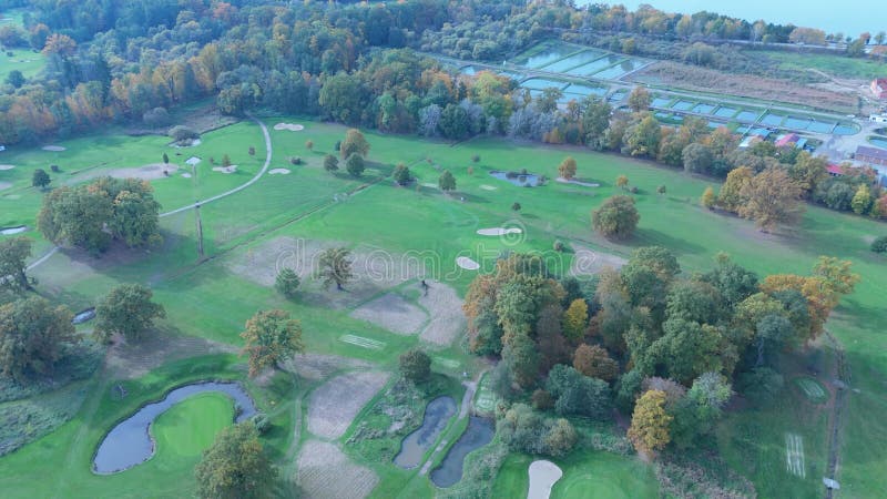 Aerial View of an Asphalt Road Surrounded by Mountains and the Blue ...