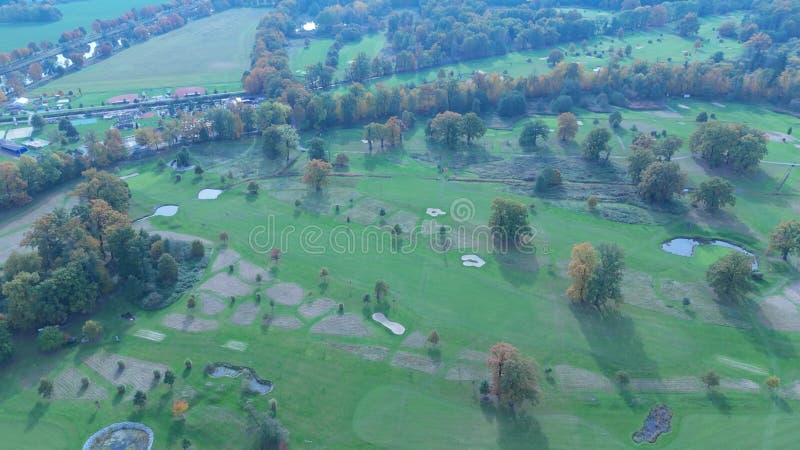 Aerial View of an Asphalt Road Surrounded by Mountains and the Blue ...
