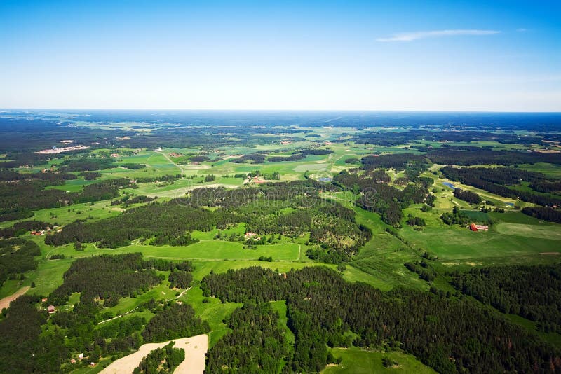 Aerial View of a Green Rural Area Under Blue Sky Stock Photo - Image of ...