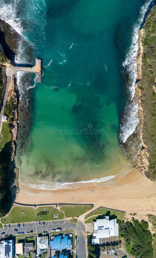 Aerial View of a Green Water Shoreline with a Sandy Beach Stock Photo ...