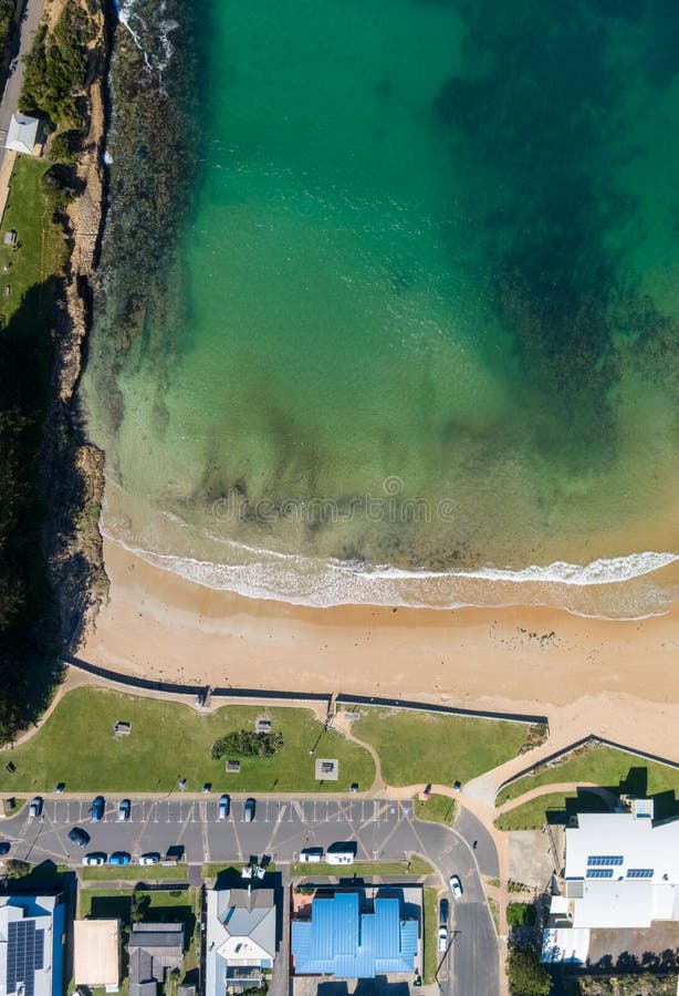 Aerial View of a Green Water Shoreline with a Sandy Beach Stock Photo ...