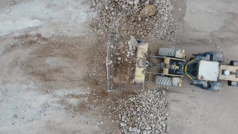 Aerial View of a Heavy Wheel Loader Pouring Material Over Sieves for ...