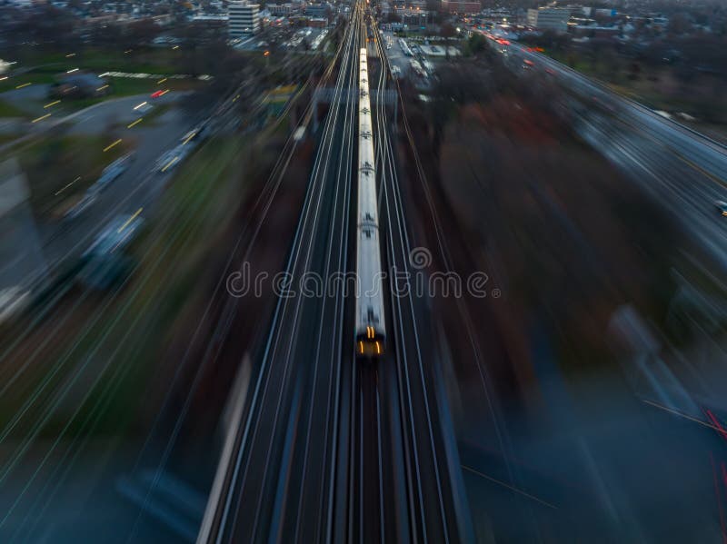 Aerial View of a High-speed Train in Motion on Tracks in the City Stock ...