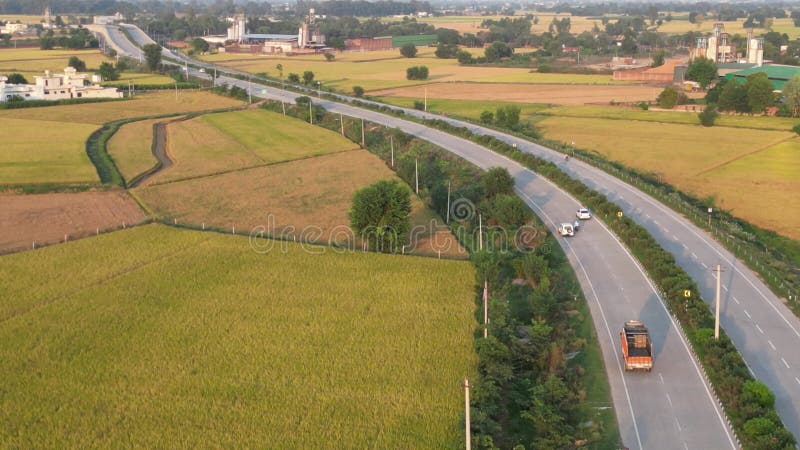 Aerial View of a Highway Road through Green Field Stock Video - Video ...