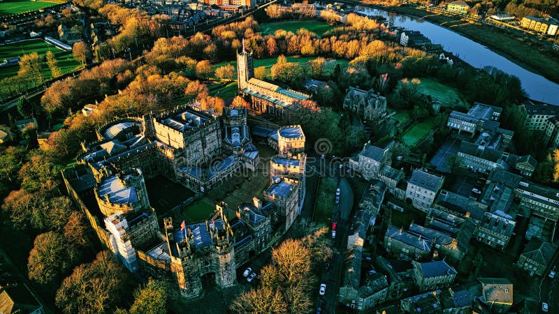 Aerial View of a Historic Lancaster Castle Surrounded by Greenery and a ...
