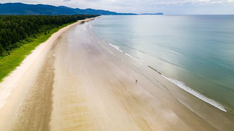 Aerial View of a Large, Empty Tropical Beach Surrounded by Lush Foliage ...