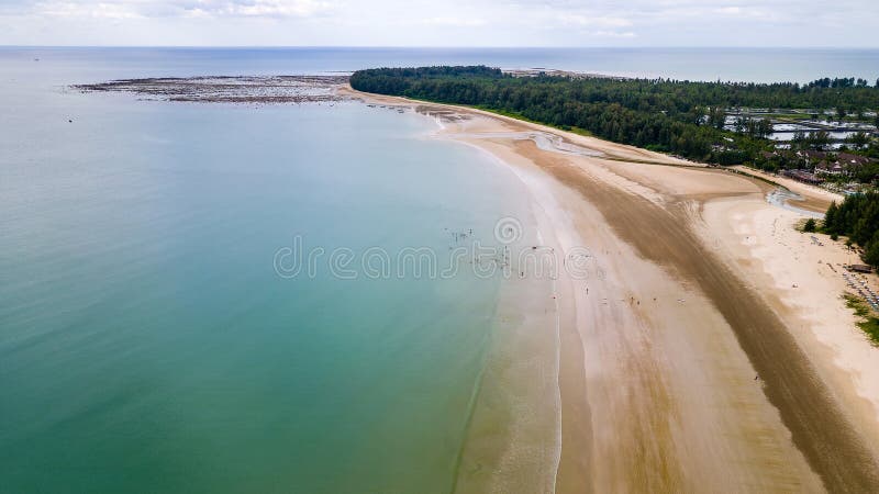 Aerial View of a Large, Empty Tropical Beach Surrounded by Lush Foliage ...