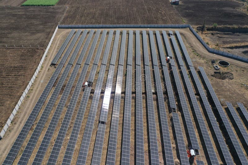 Aerial View of a Large-scale Solar Farm with an Array of Black Solar ...