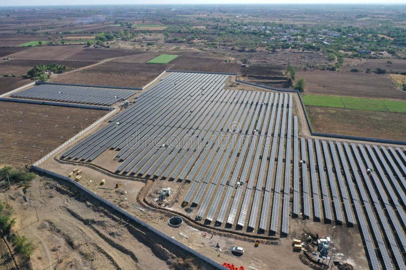 Aerial View of a Large-scale Solar Farm with an Array of Black Solar ...