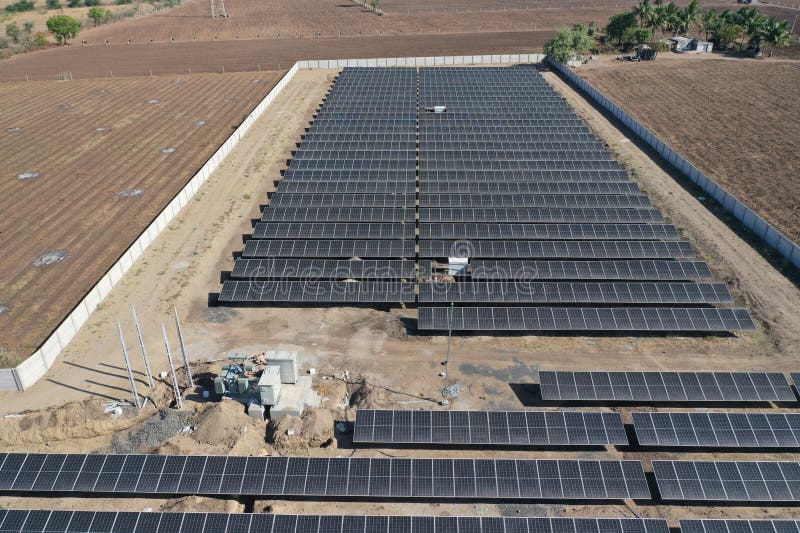 Aerial View of a Large-scale Solar Farm with an Array of Black Solar ...