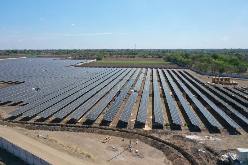 Aerial View of a Large-scale Solar Farm with an Array of Black Solar ...