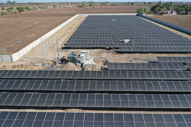 Aerial View of a Large-scale Solar Farm with an Array of Black Solar ...