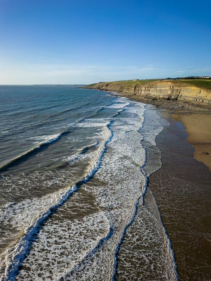 Aerial View of Limestone Cliffs and a Rock Covered Sandy Beach Stock ...