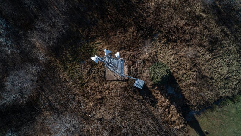 Aerial View Looking Down at a Communication Tower with Satellite Dishes ...