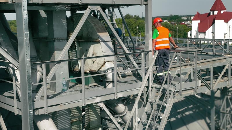 Aerial View Maintenance Work on Industrial Equipment, Worker Performing ...