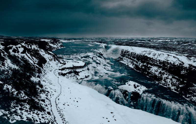 An Aerial Shot of a Water Fall with Dark Clouds Above Stock Image ...