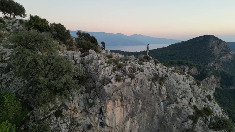 Aerial View of Man Standing on the Rock. Stock Footage - Video of ...