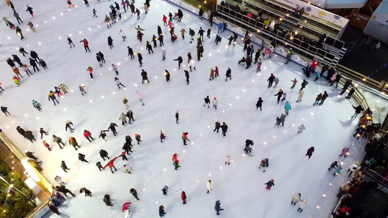 Aerial View Many People Skating on Open-air Ice Rink Winter New Year ... Aerial View Many People Skating on Open-air Ice Rink Winter New Year ...