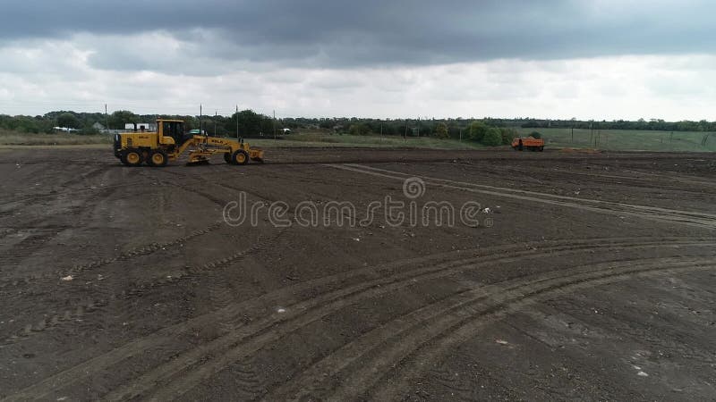 Huge Heavy Machine in the Field is Leveling the Soil, Construction ...