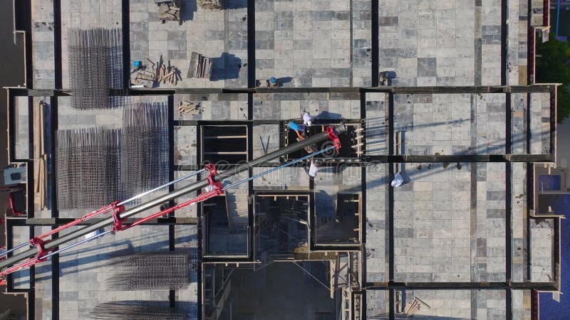 Aerial View: Metal Framework and Concrete Pouring Combine To Create ...