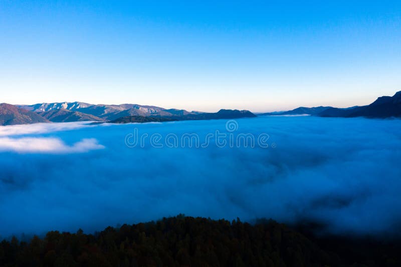 Aerial View of Mist and Clouds in the Valley in Sunrise Stock Photo ...