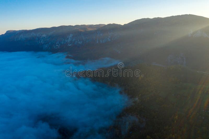 Aerial View of Mist and Clouds in the Valley in Sunrise Stock Photo ...