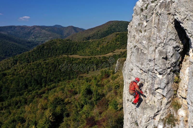 Aerial View of Mountain Rescuer Doing Rescue Operations Hanging on a ...