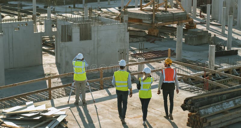 Aerial View of a New Constructions Development Site with Diverse Team of Engineers and ...