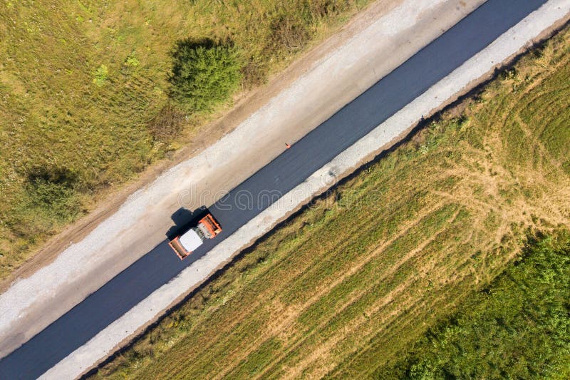 Aerial View of New Road Construction with Steam Roller Machine at Work ...