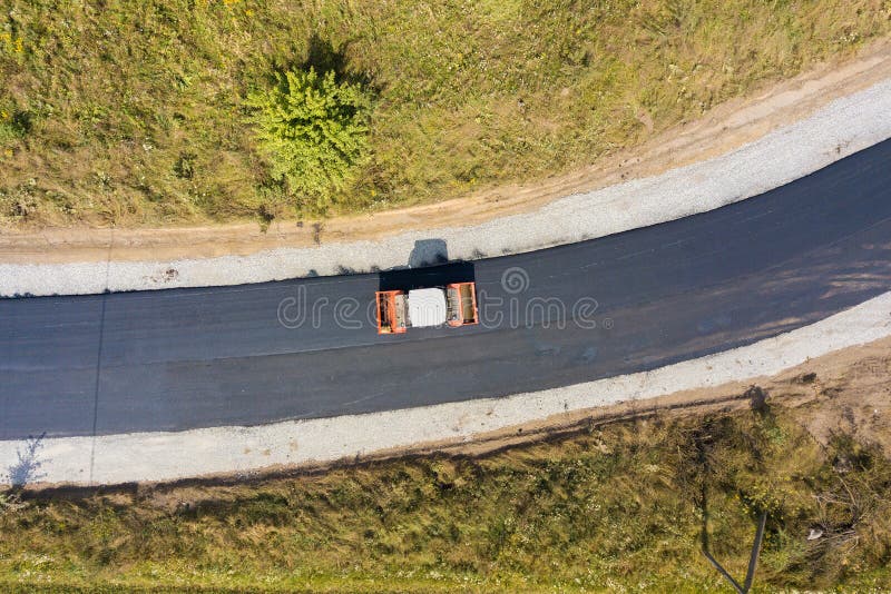 Aerial View of New Road Construction with Steam Roller Machine at Work ...