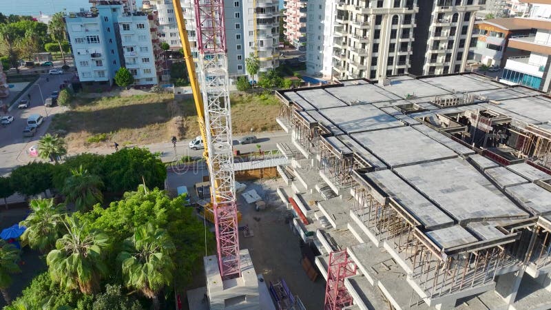 Aerial View: Operator Assembles Crane Components and Climbs Ladders ...