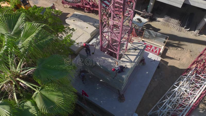 Aerial View: Operators and Engineers Install a Crane with Precision on ...