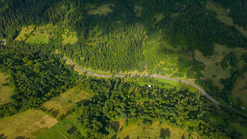 Aerial View Over Mountain Road Going through Forest Landscape Stock ...