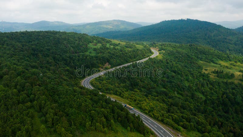 Aerial View Over Mountain Road Going through Forest Landscape Stock ...