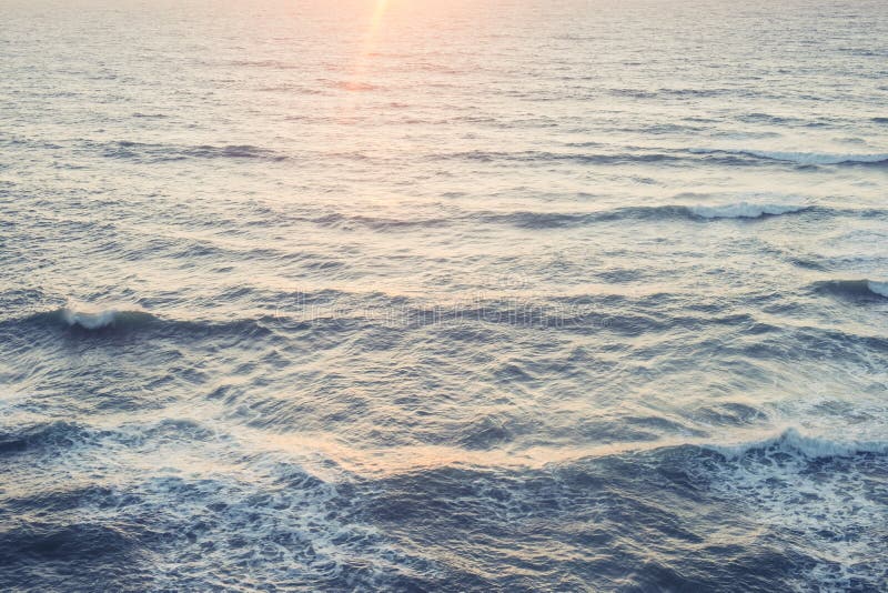 Aerial View Over the Ocean and Sun Rising Over Water Waves Surface ...