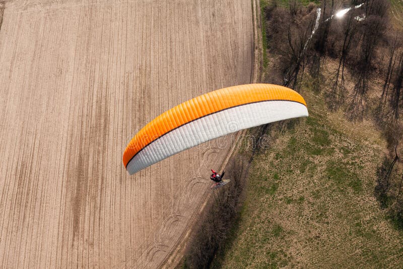 Aerial View of Paramotor Flying Over the Fields I Stock Photo - Image ...