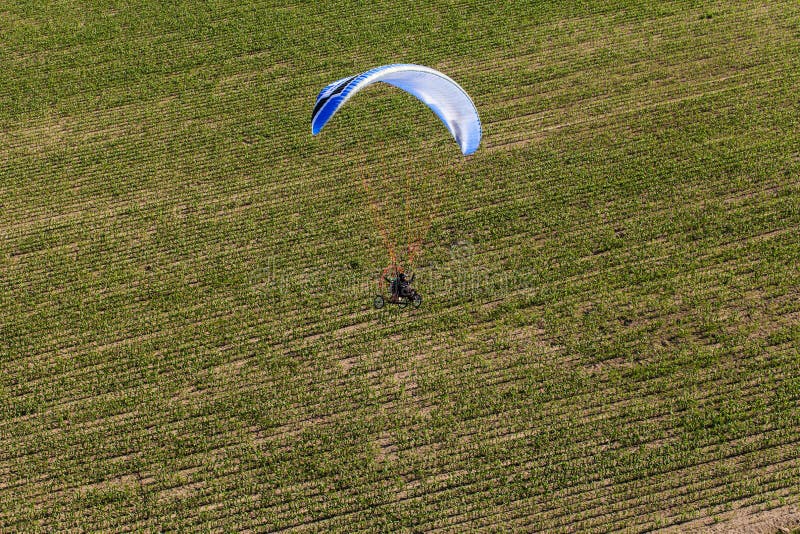 Aerial View of Paramotor Flying Over the Fields Stock Photo - Image of ...